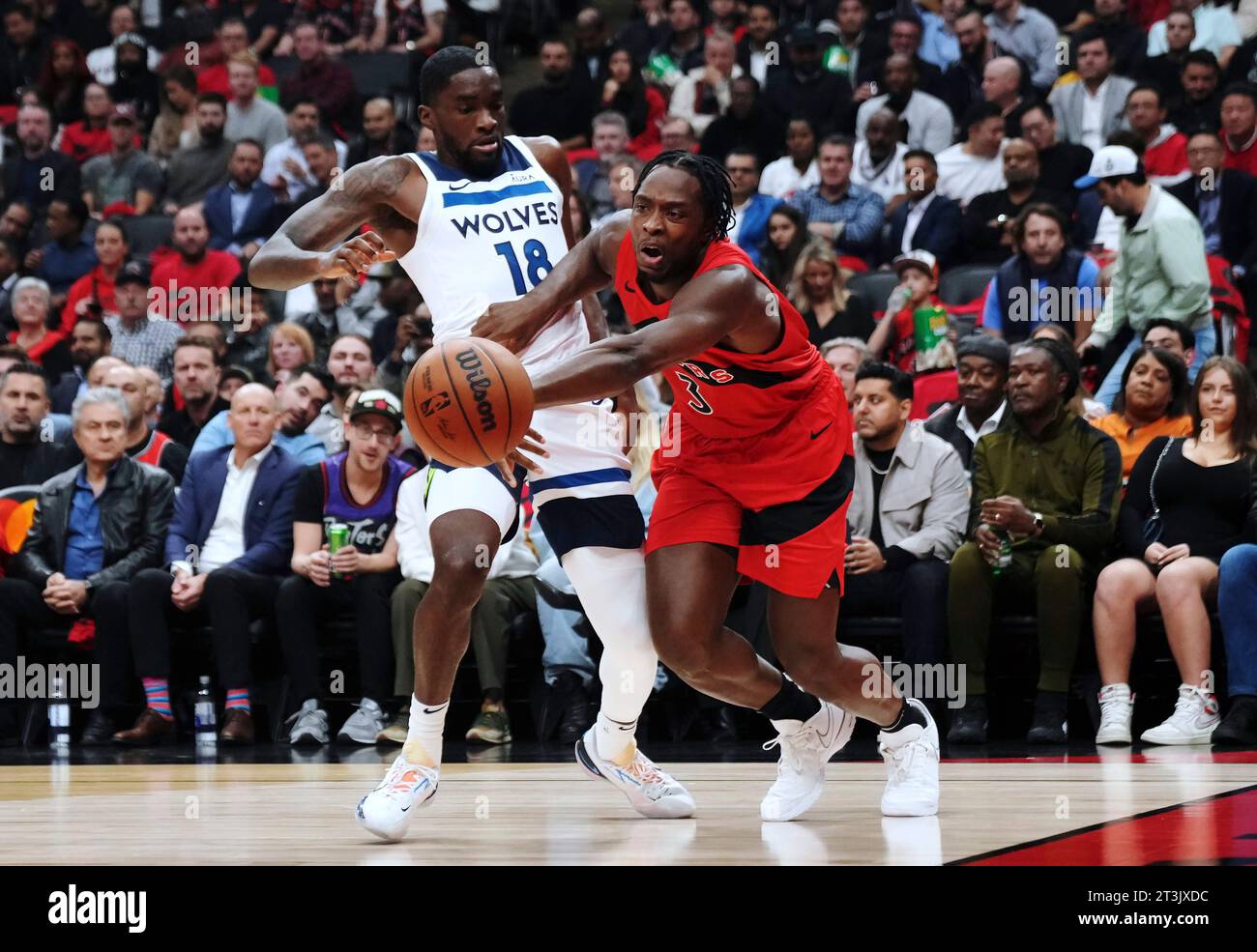 Minnesota Timberwolves' Shake Milton (18) trips Toronto Raptors' O.G ...