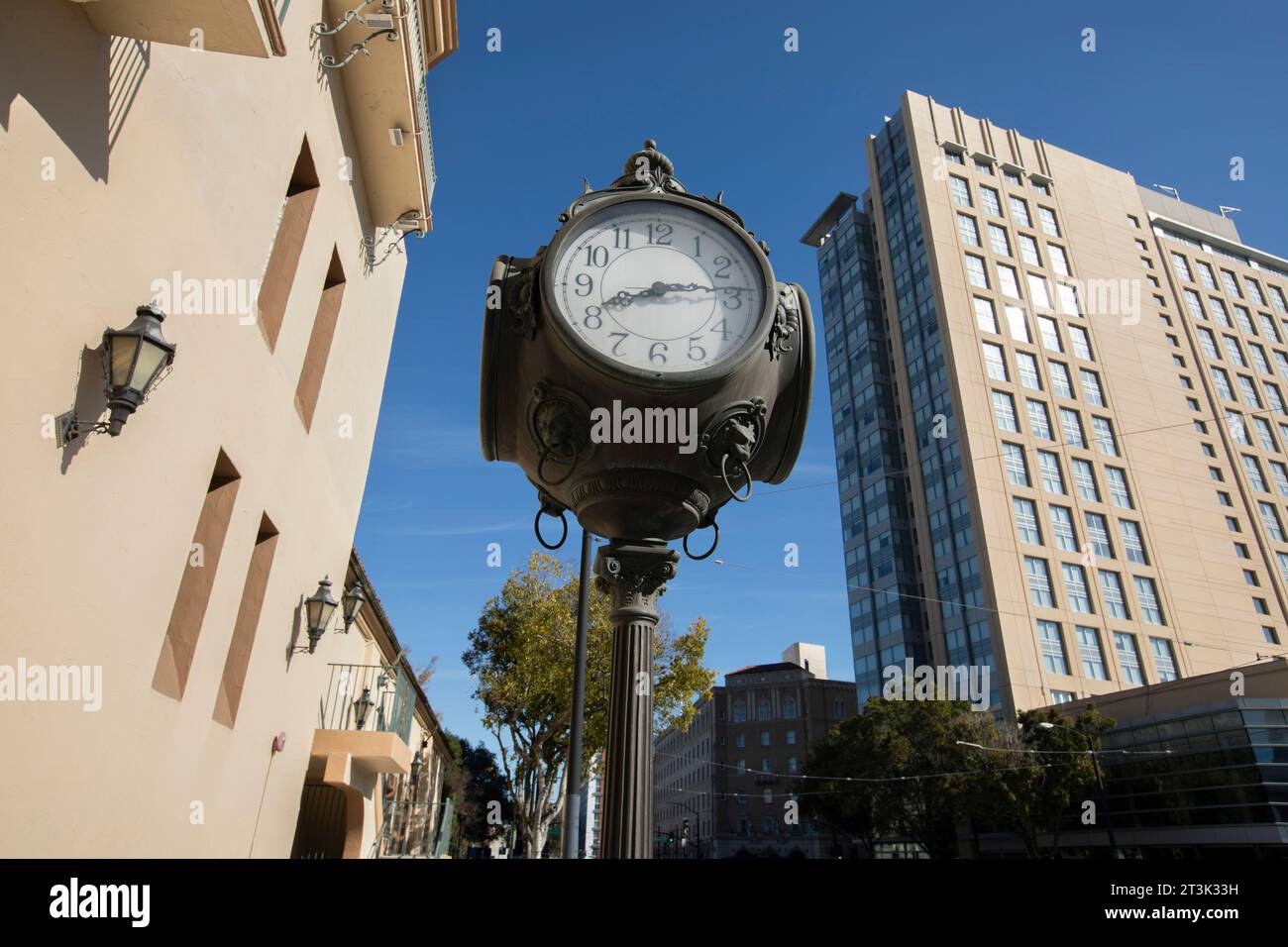 Daytime view of a historic clock and downtown skyline of San Jose ...