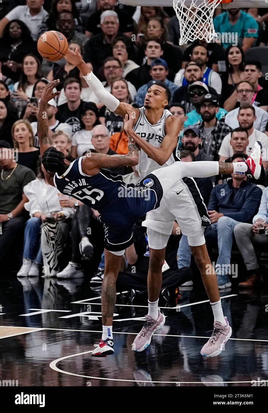 Dallas Mavericks forward Derrick Jones Jr. (55) has his shot blocked by ...