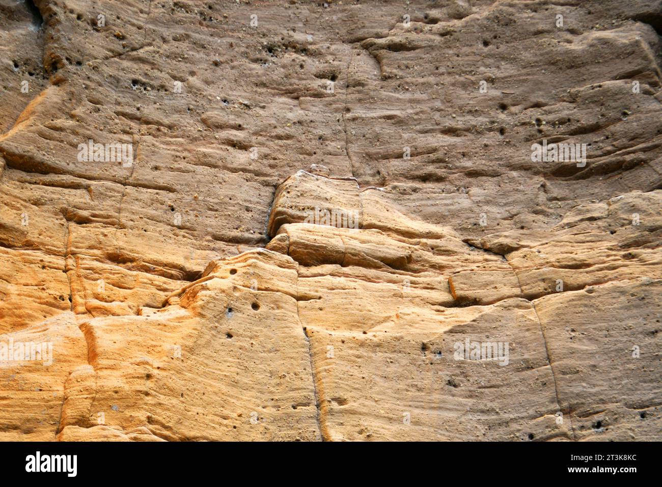 Photo of weathered eroded yellow rock surface Stock Photo - Alamy