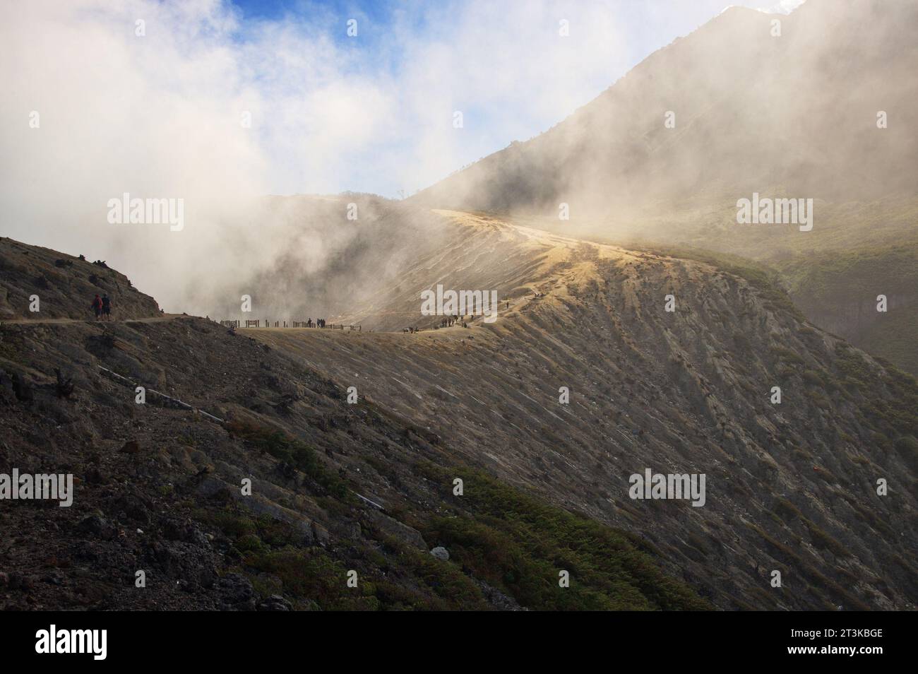 Scenic view of Ijen volcano, Indonesia with clouds above the rim of the ...
