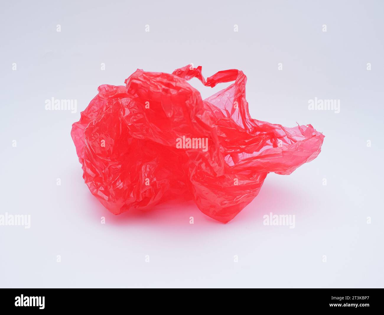 red plastic bag trash isolated on white Stock Photo - Alamy