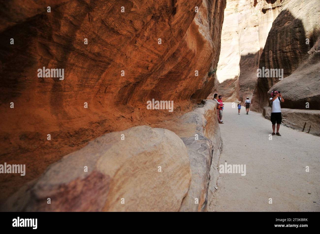 The ruins ancient path between cliffs in Petra, Jordan Stock Photo - Alamy