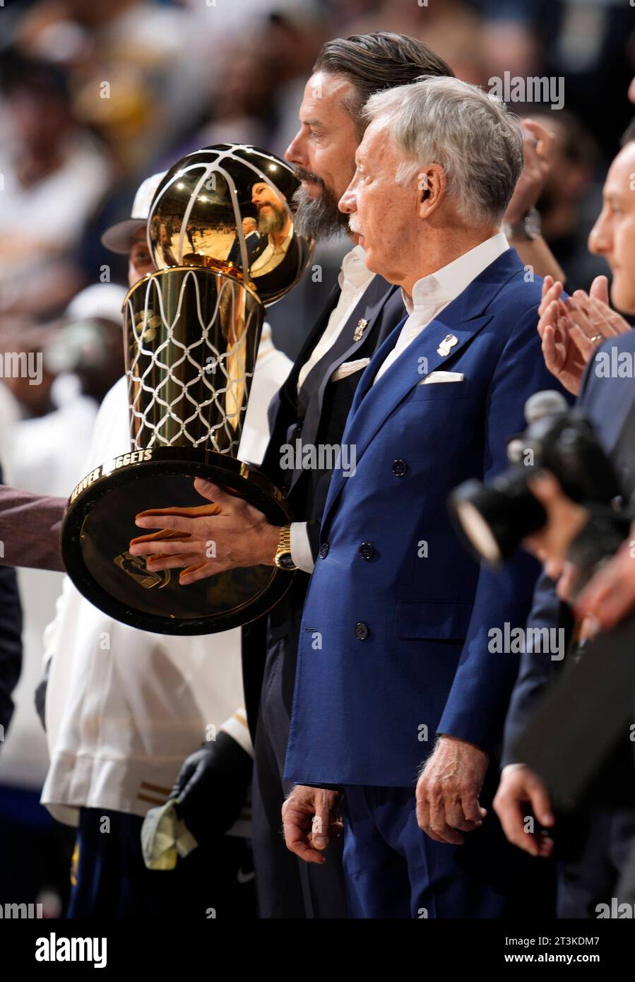 Denver Nuggets governor Josh Kroenke, back, and his father, E. Stanley ...