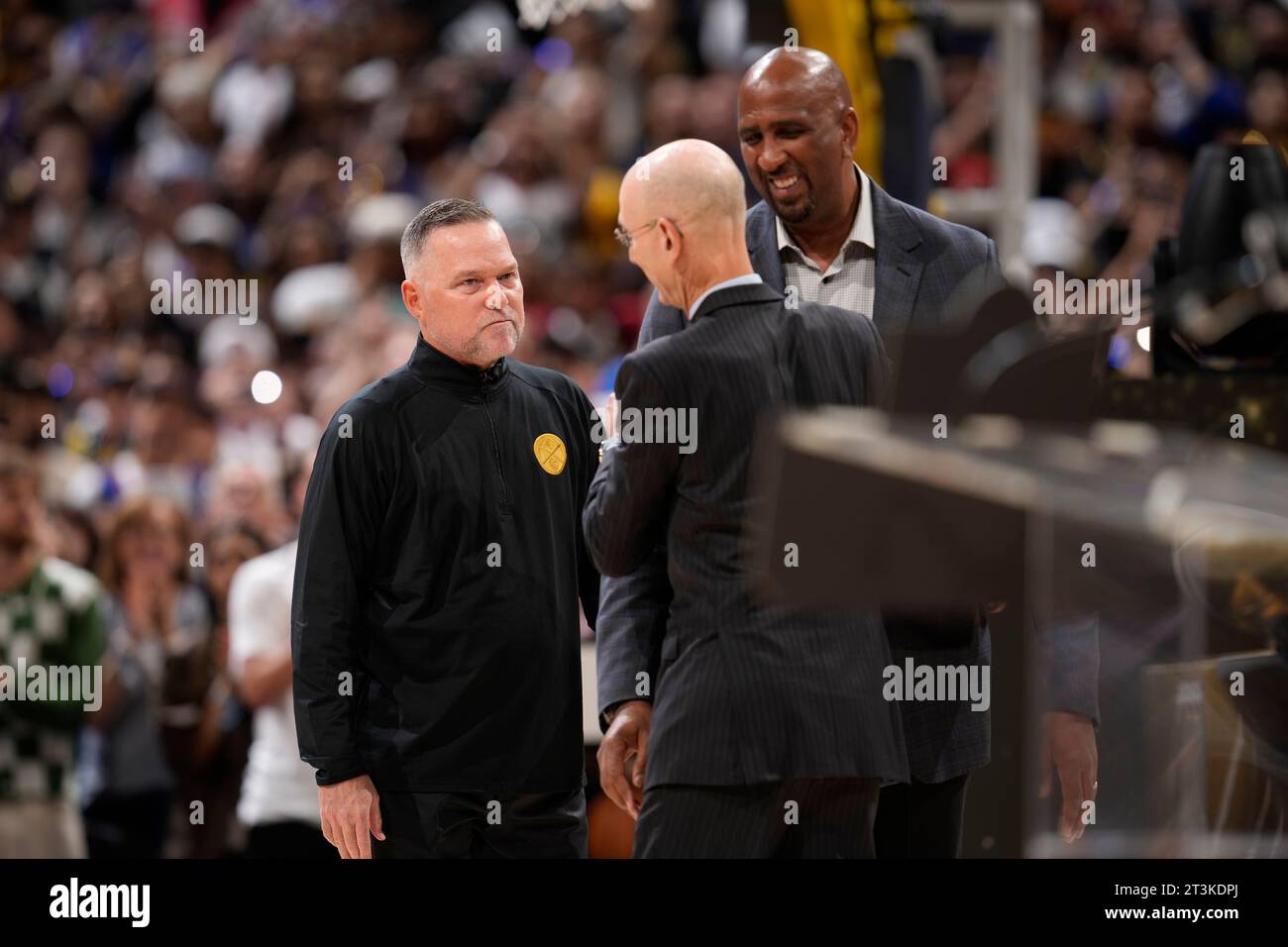 NBA Commissioner Adam Silver, front, presents championship rings to ...