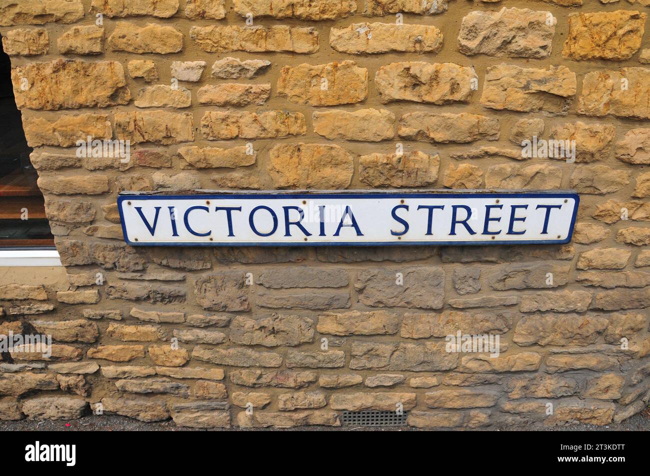 Photo of road signs on brick walls in Britain Stock Photo - Alamy
