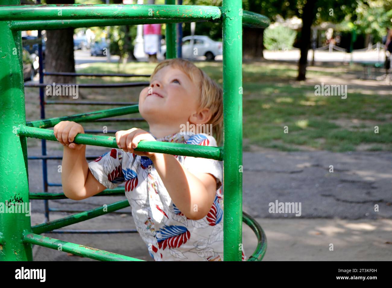 Little children run around and play in the playground. Game center for ...