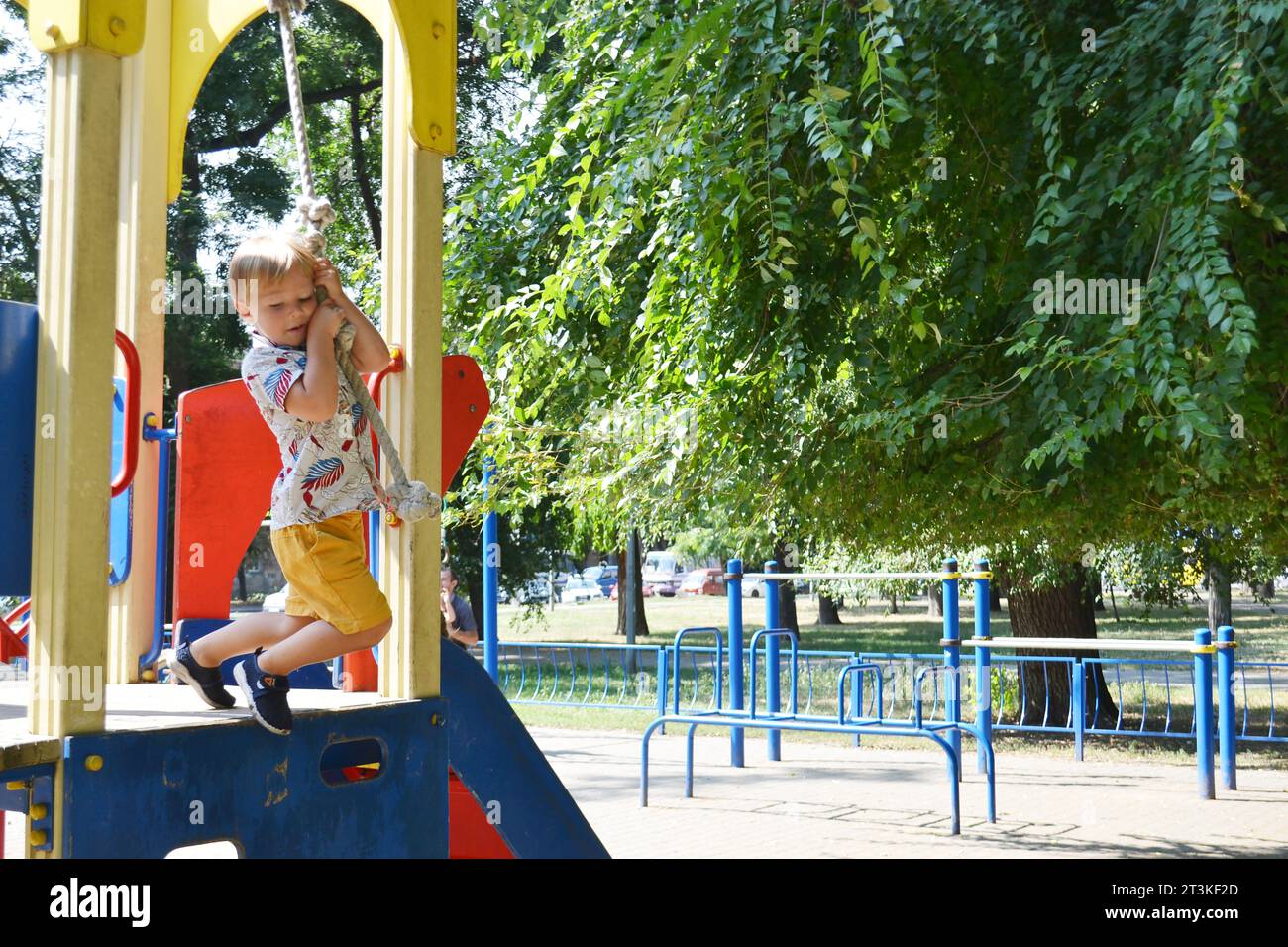 Little children run around and play in the playground. Game center for ...