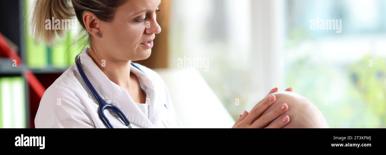 Lady dermatologist examines head skin of bald man in clinic Stock Photo ...