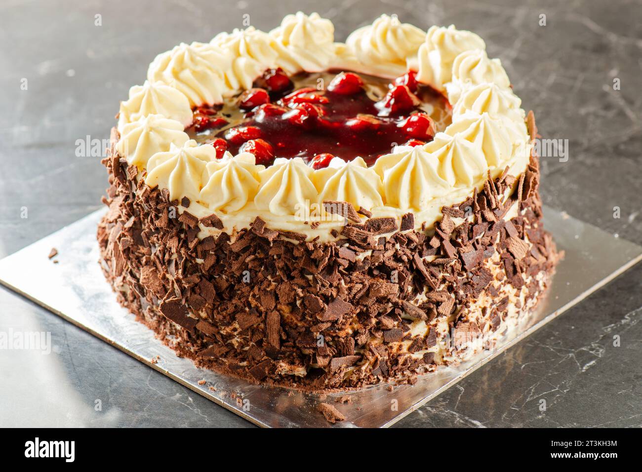 Black forest gateaux cake with a chocolate sponge, cherry compote, and ...