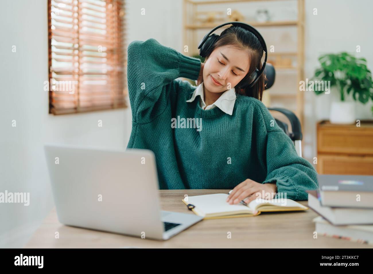 Studying online, beautiful Asian female student show symptoms burnout ...