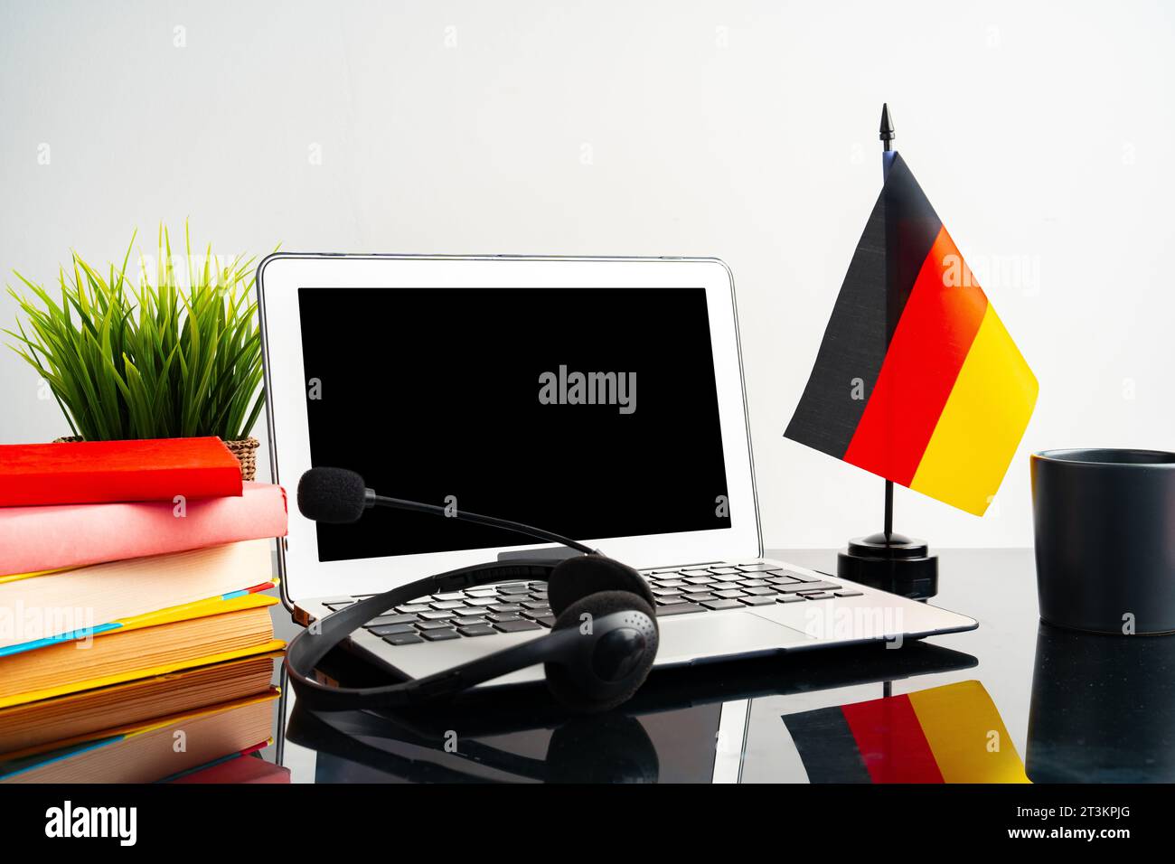 Laptop with German flag on working table, educational concept Stock ...