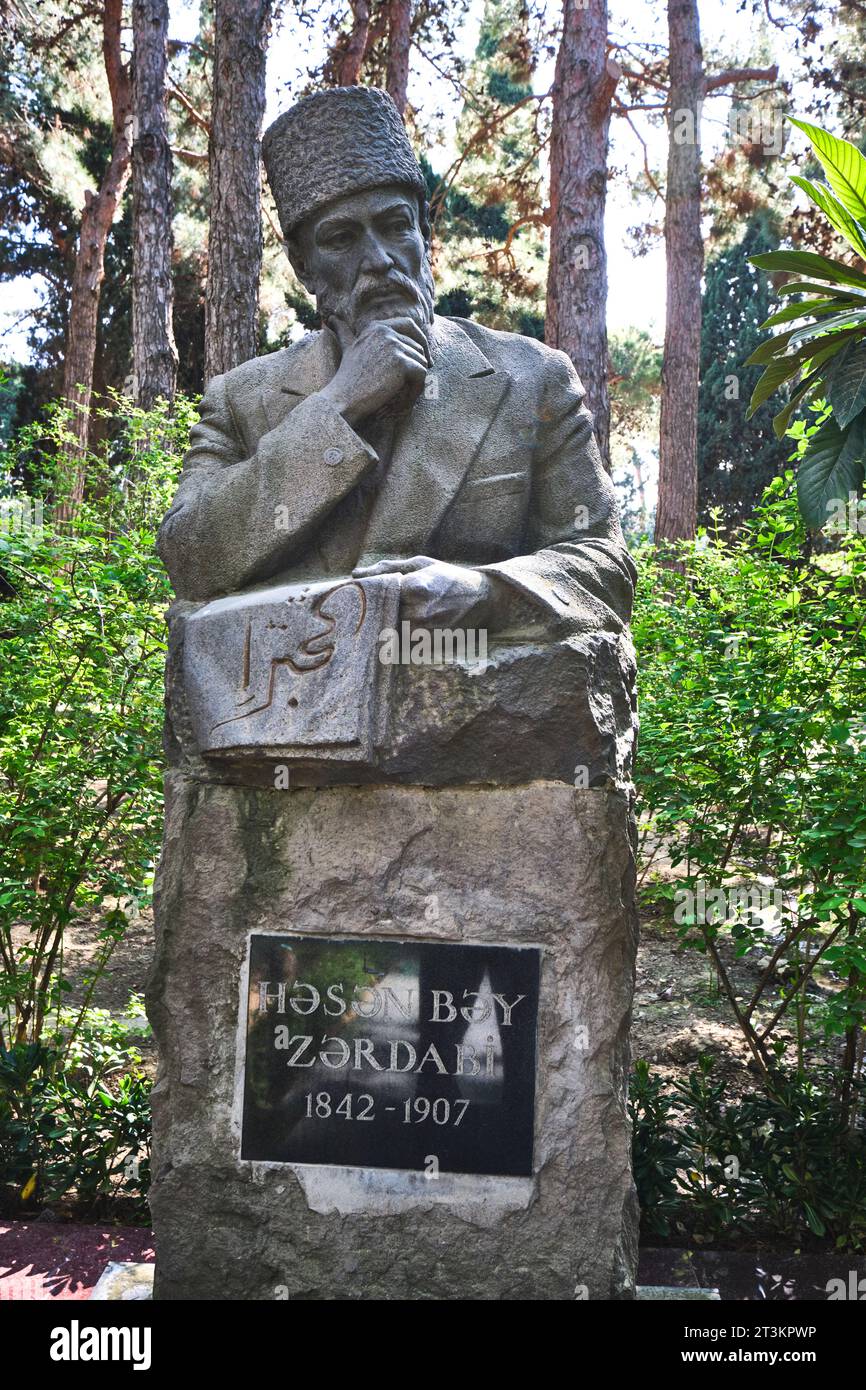 One of the gravesites and statues of a famous writer in the park. At ...