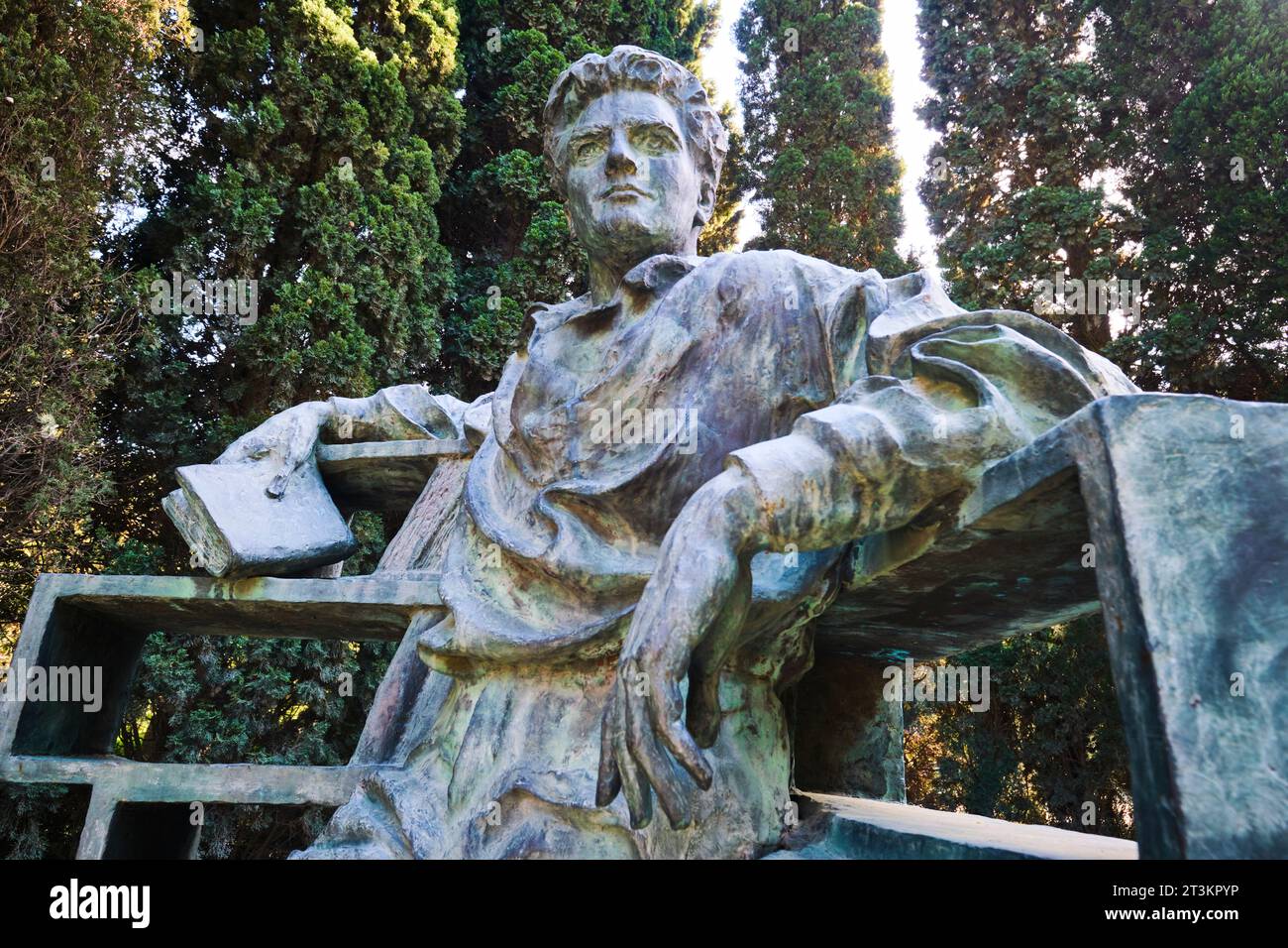 One of the gravesites and statues of a famous writer in the park. At ...