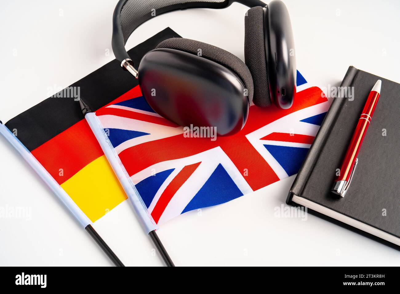 German and British flags with notepad on white background Stock Photo ...