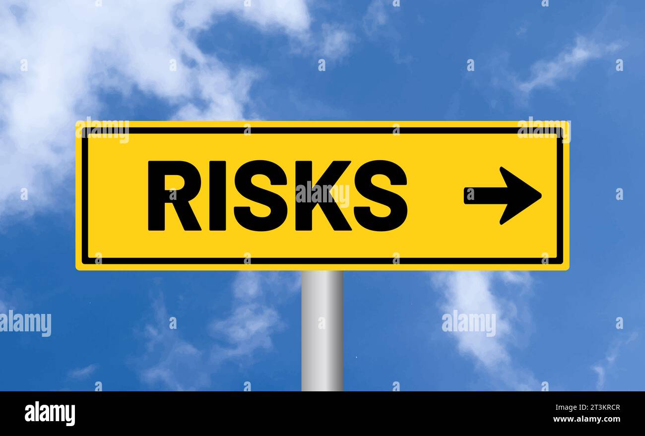 Risks road sign on cloudy sky background Stock Photo - Alamy