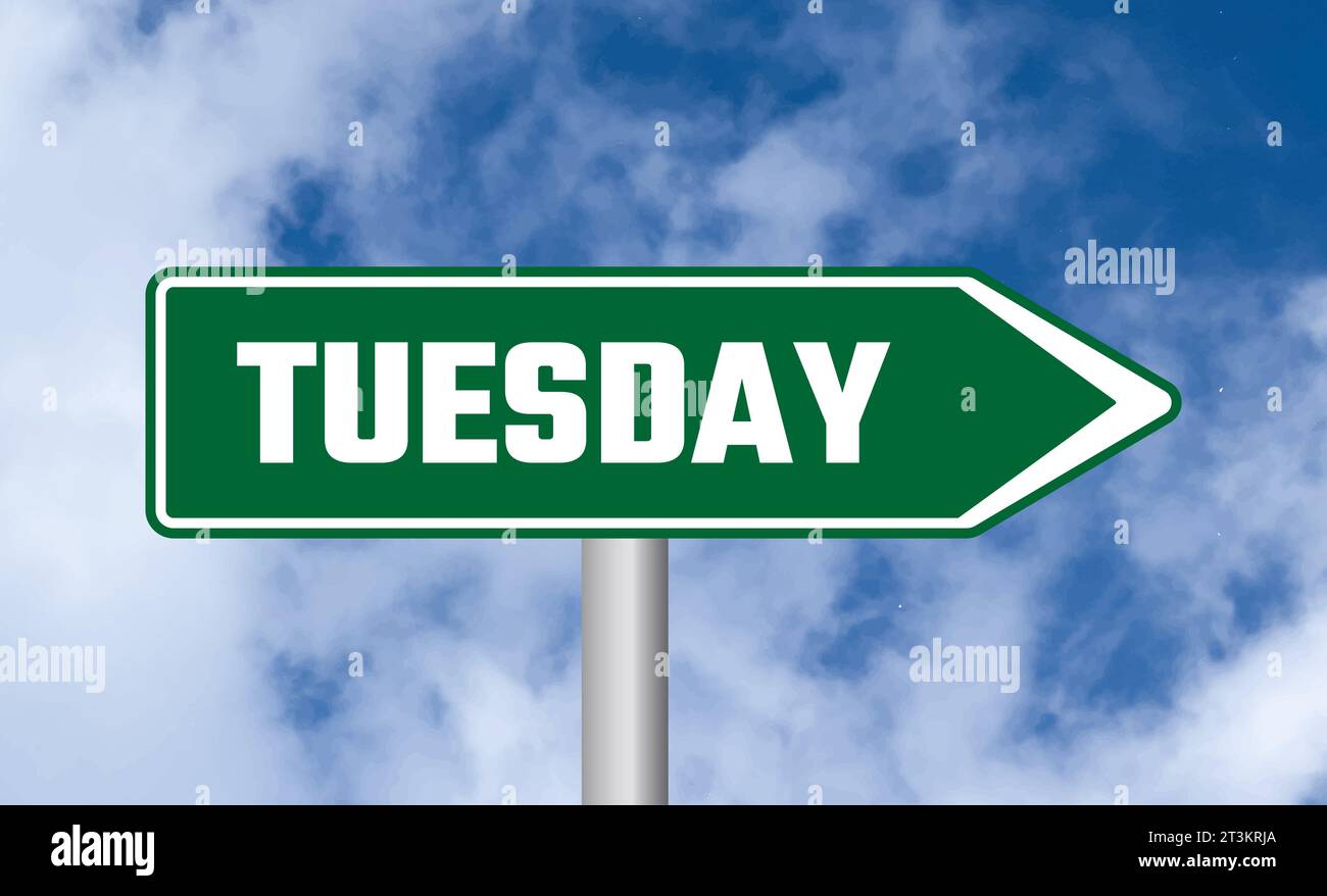 Tuesday road sign on blue sky background Stock Photo - Alamy