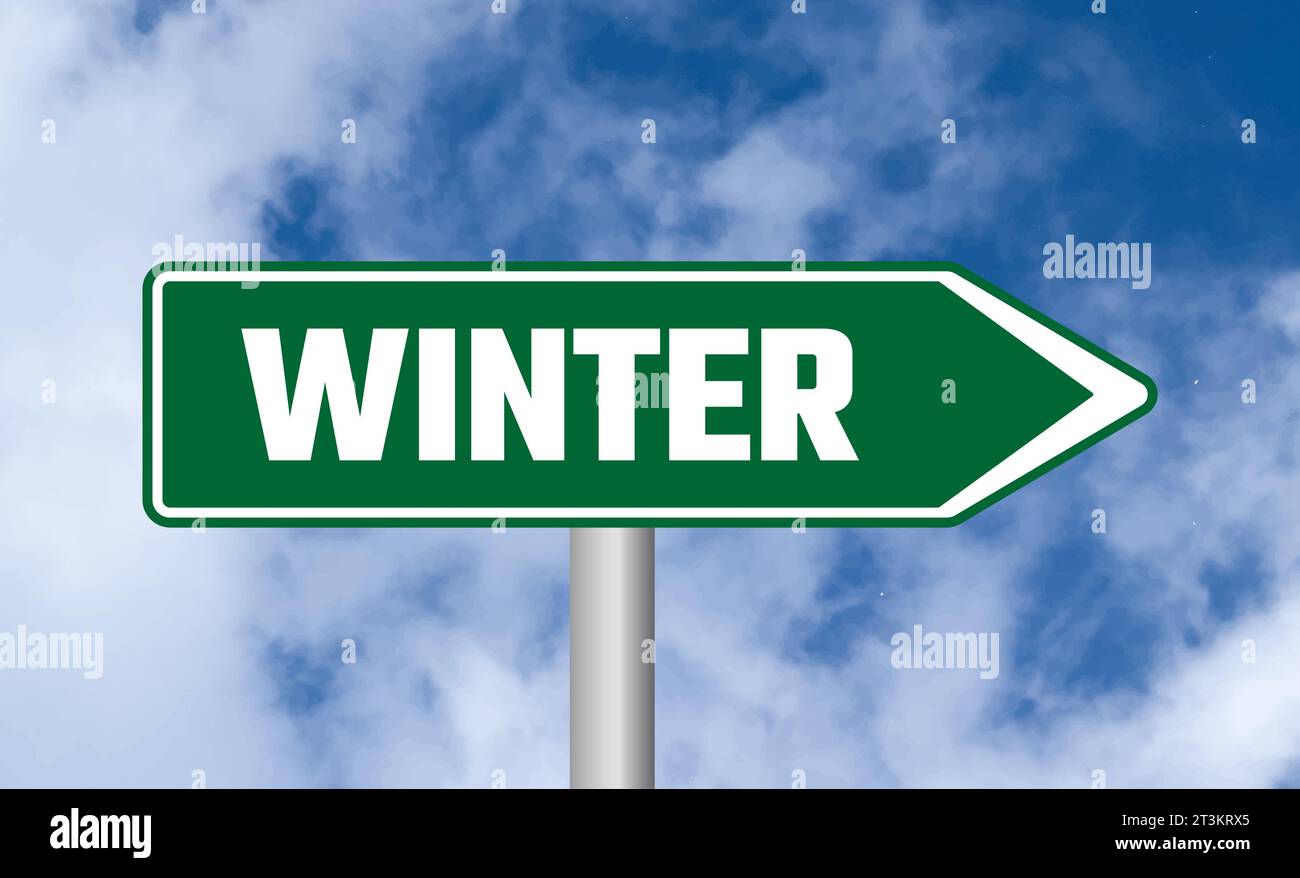 Winter road sign on sky background Stock Photo - Alamy