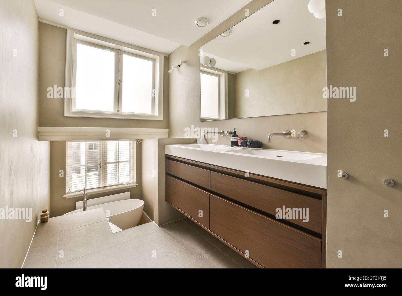 a bathroom with a toilet, sink and window in the back wall is not ...