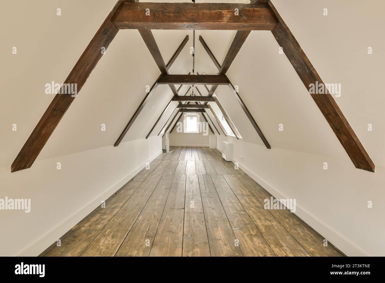 an empty room with wood flooring and exposed beams on the ceiling in ...