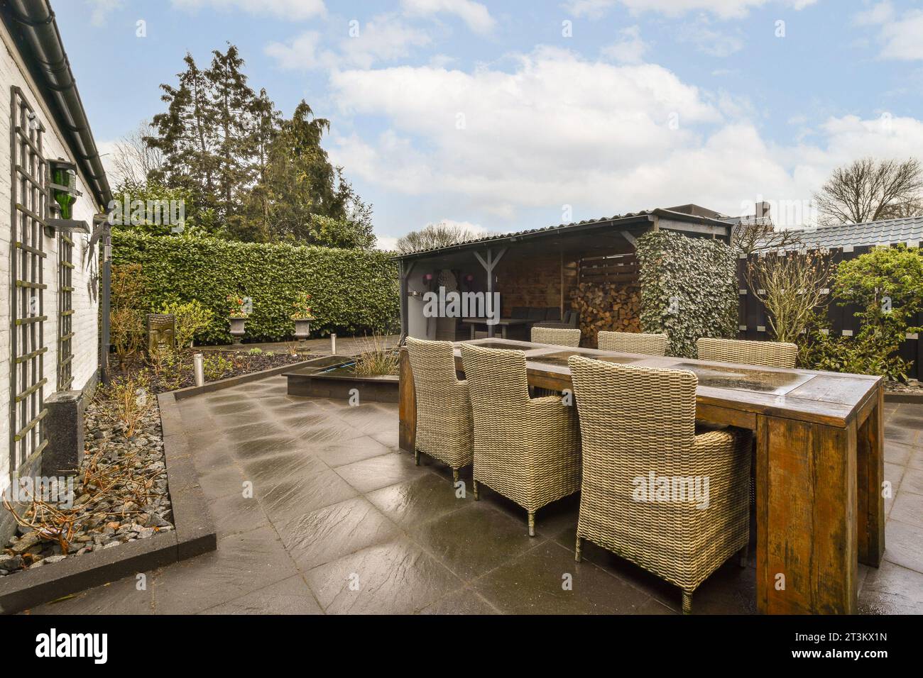 a patio with wickers on the table and chairs in front of an outdoor ...