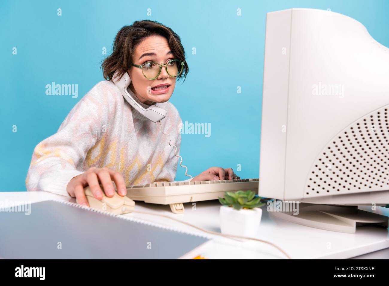 Portrait of busy worried agent girl communicate cable telephone use old ...
