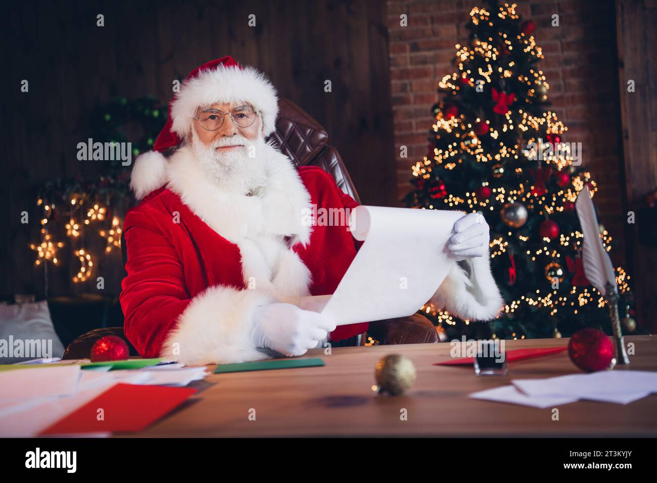 Photo of cheerful positive santa claus dressed red costume reading new ...