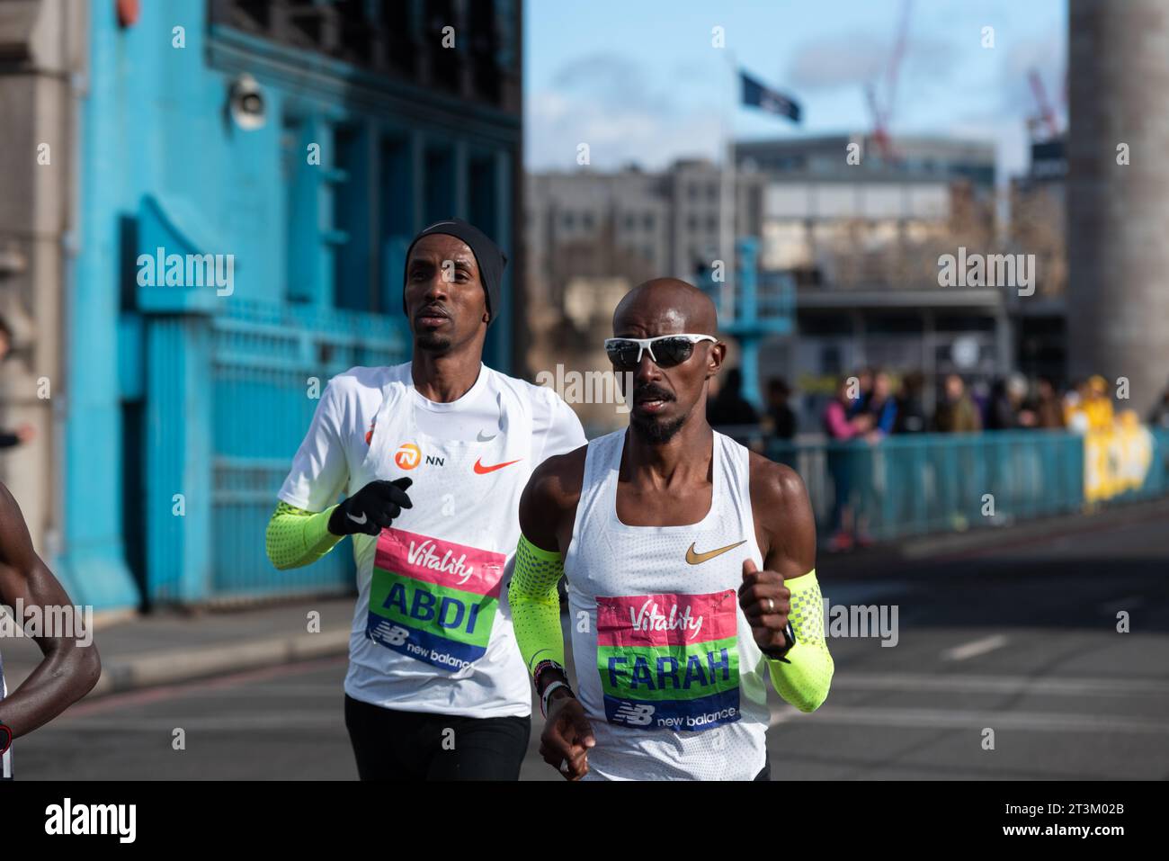 Mo Farah and Bashir Abdi running in the Vitality Big Half half marathon, crossing Tower Bridge ...