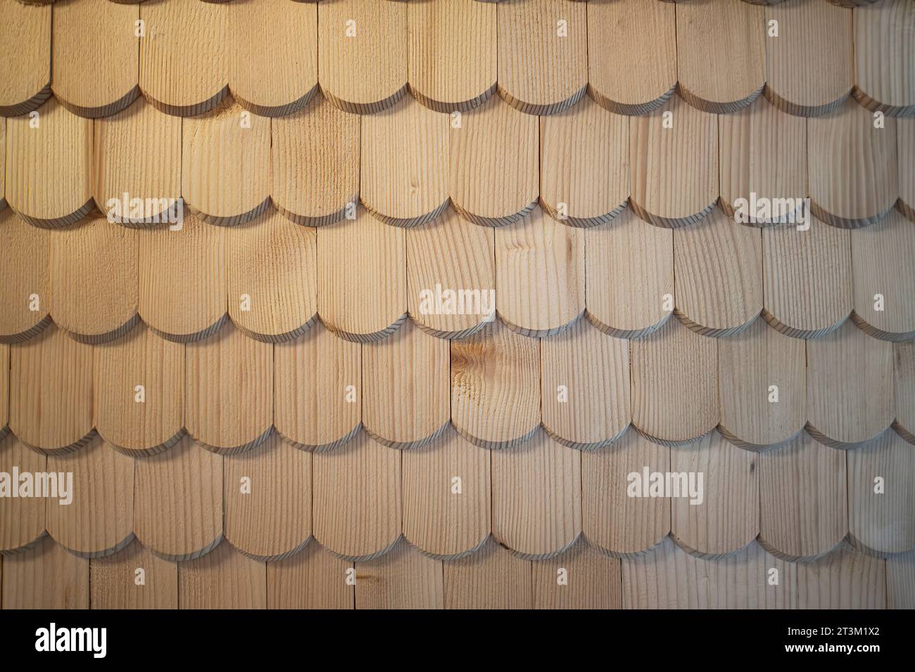 Wooden shingles are arranged like fish scales, surface, pattern and ...