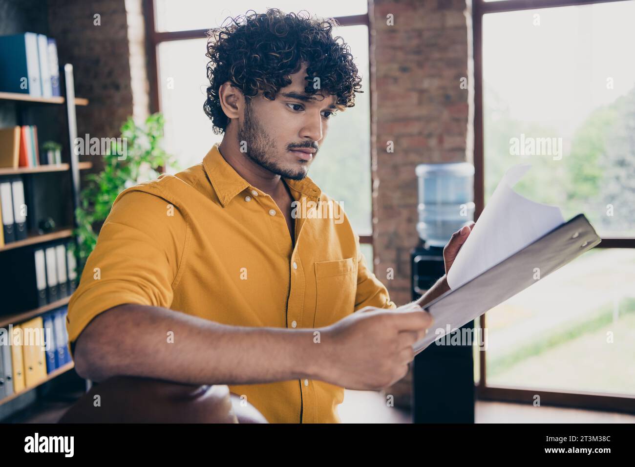 Photo portrait of attractive young man wear yellow shirt boss read ...