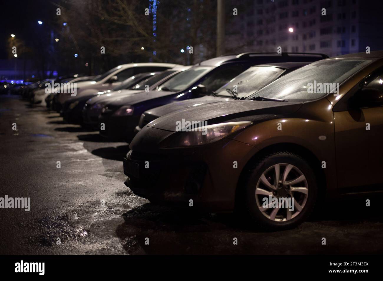 Car in the parking lot at night. Vehicles are parked in the yard. Cars ...