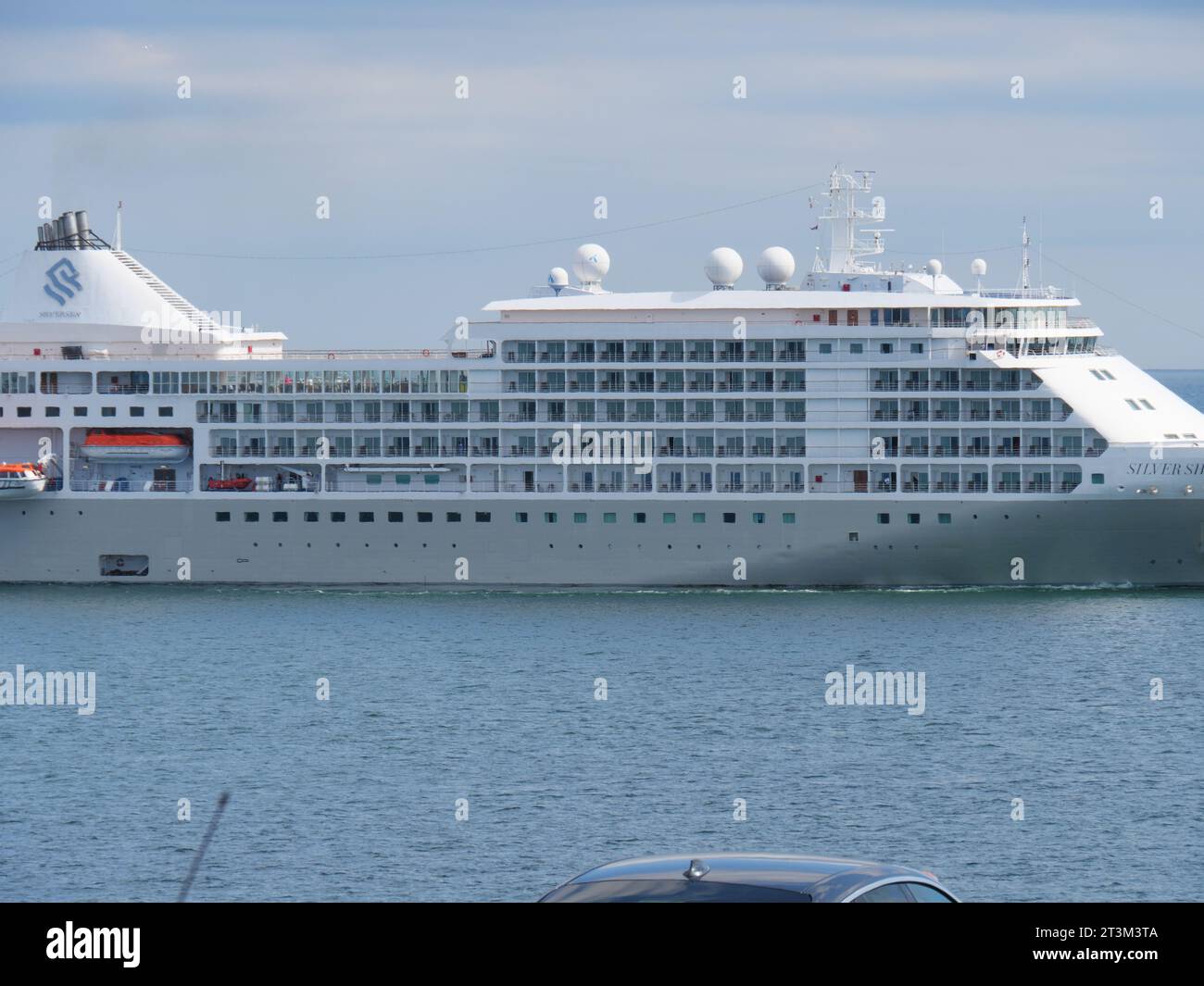 A white cruise ship sailing off the English coast near Falmouth England ...