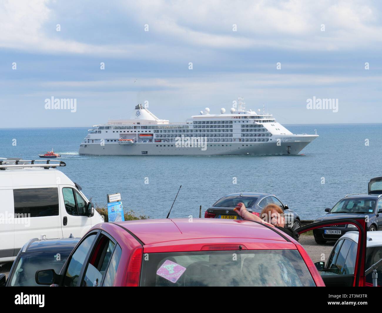 A white cruise ship sailing off the English coast near Falmouth England ...
