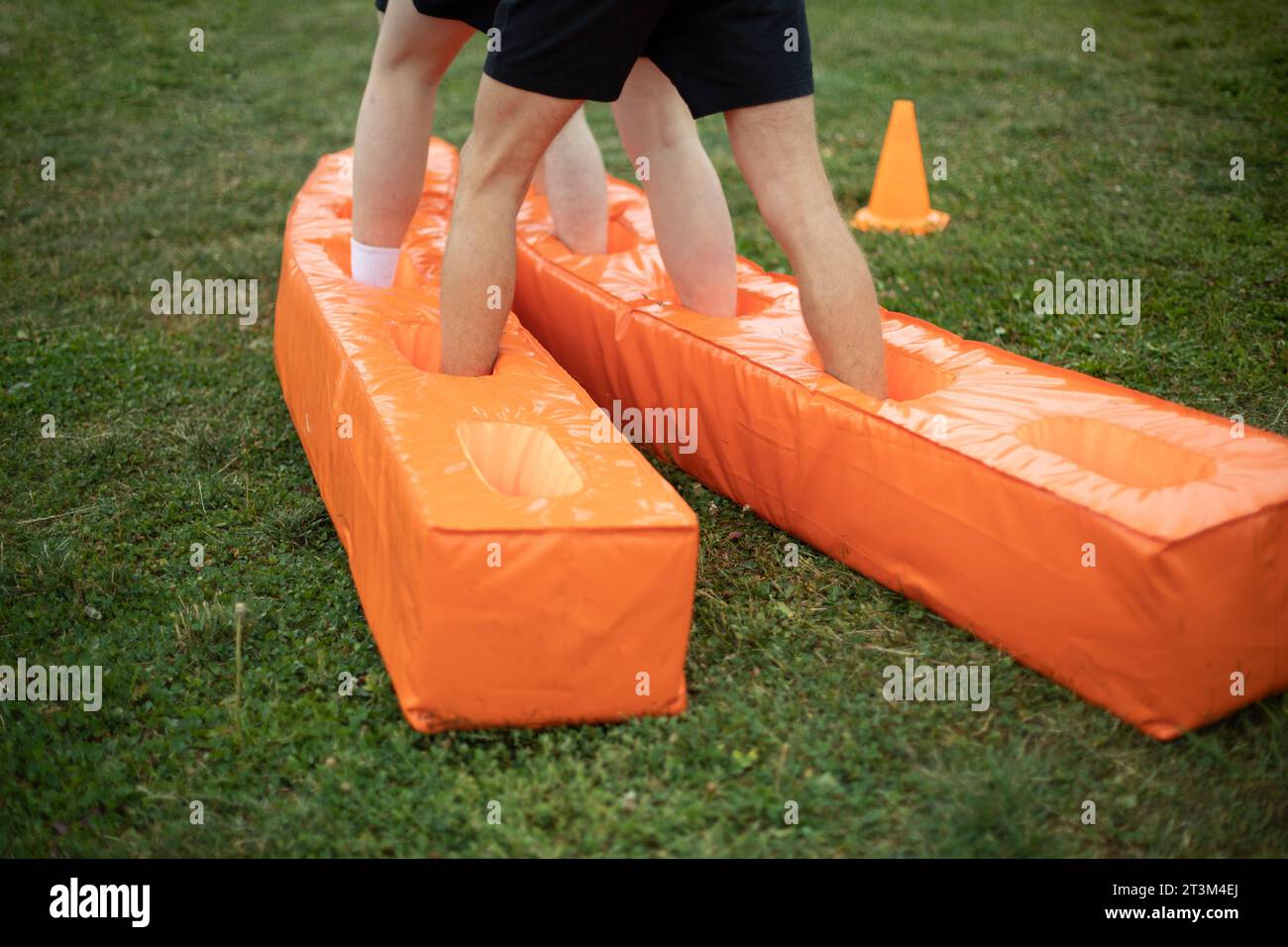 Men feet in shorts. Sports competition in stadium. Fun sport. Leg ...