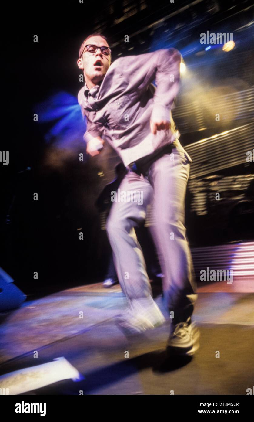 ROBBIE WILLIAMS, SINGER, FIRST TOUR, 1997: Robbie Williams playing live ...