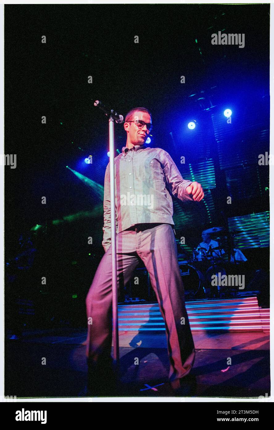 ROBBIE WILLIAMS, SINGER, FIRST TOUR, 1997: Robbie Williams playing live ...