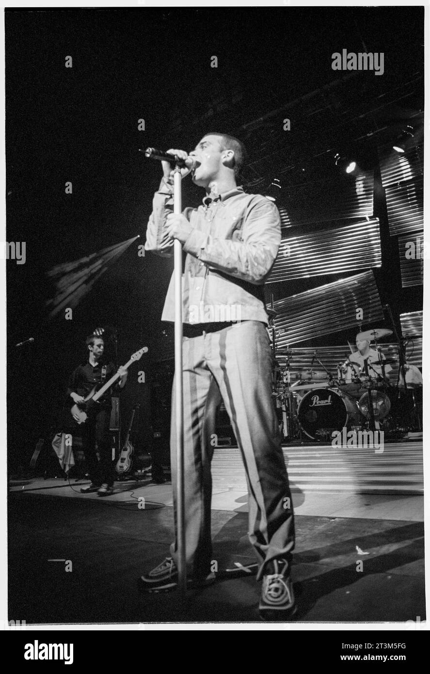 ROBBIE WILLIAMS, SINGER, FIRST TOUR, 1997: Robbie Williams playing live ...