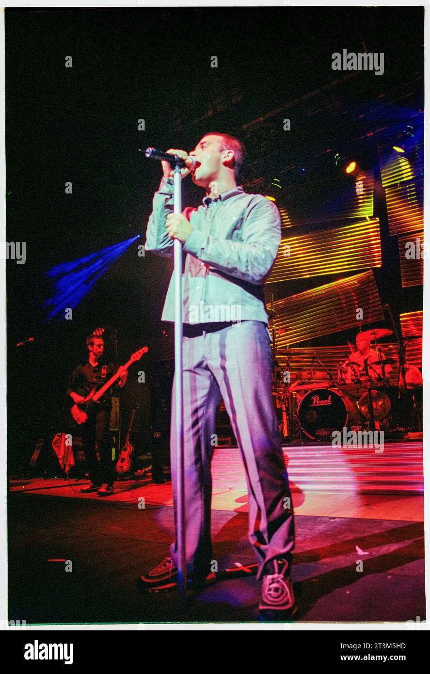 ROBBIE WILLIAMS, SINGER, FIRST TOUR, 1997: Robbie Williams playing live ...