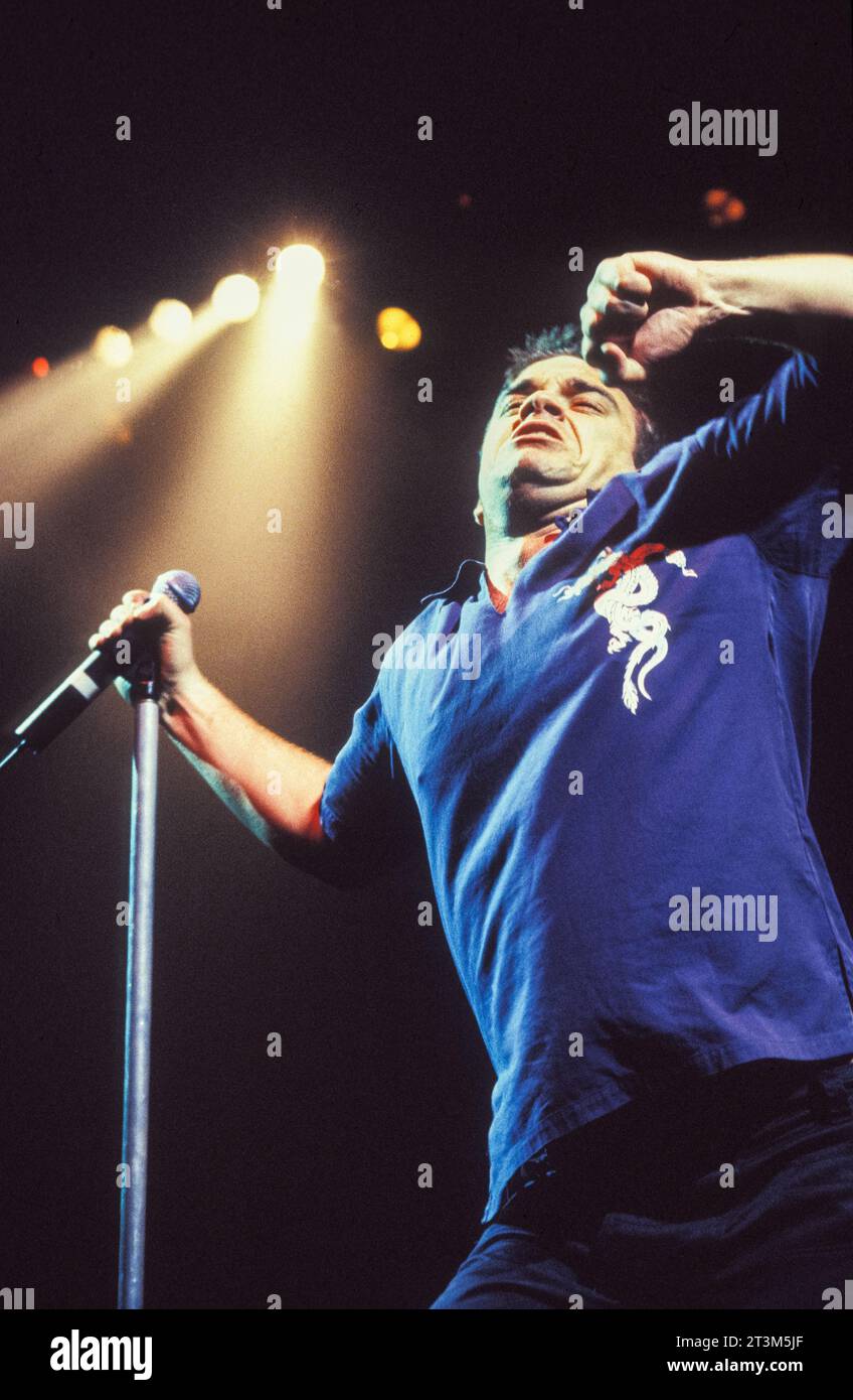 ROBBIE WILLIAMS, CARDIFF, 1999: Robbie Williams on his One More For The ...