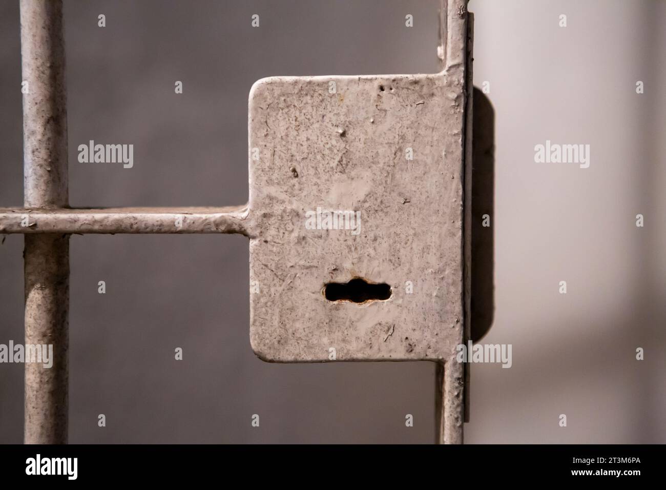 Close up of lock on cell-type barred door Stock Photo - Alamy