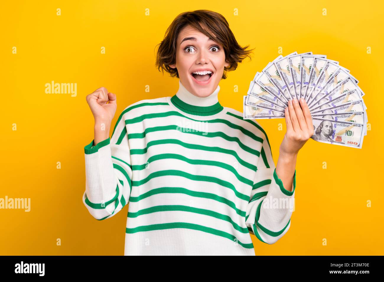 Photo of overjoyed positive lady arm hold dollar banknotes bills raise ...