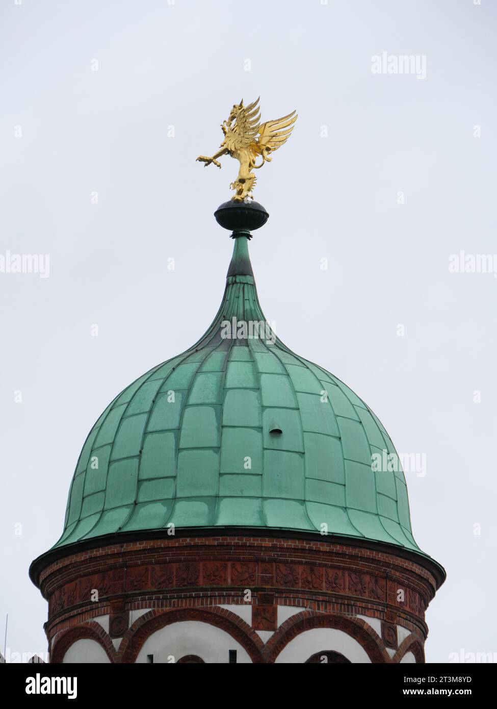Golden griffin on the top of a spire covered with copper sheet at ...