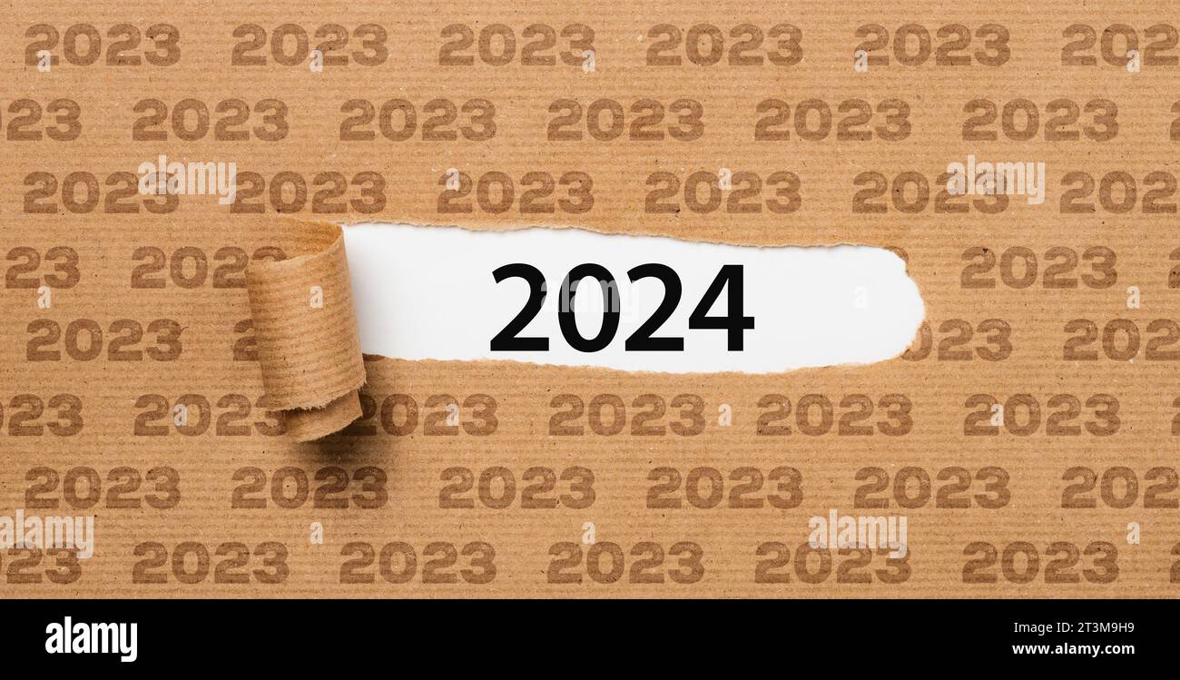 Torn paper revealing the number 2024 Stock Photo - Alamy