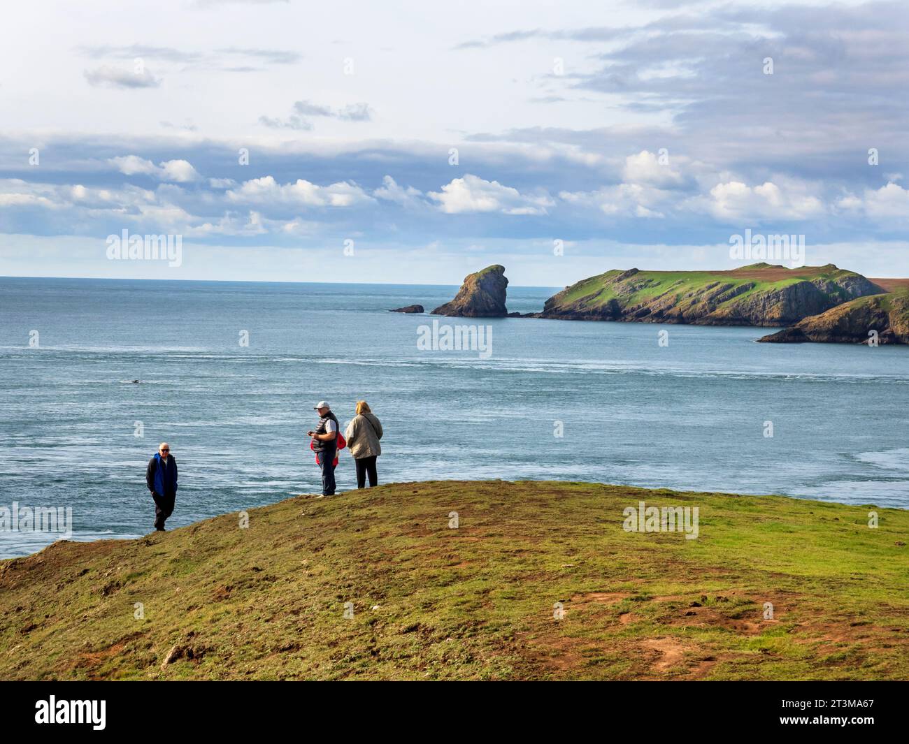 Hikers at Wooltack Point, Martins Haven in Pembrokeshire, Wales, UK ...