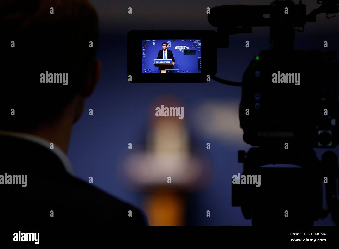 Prime Minister Rishi Sunak is seen on the screen of a camera as he ...