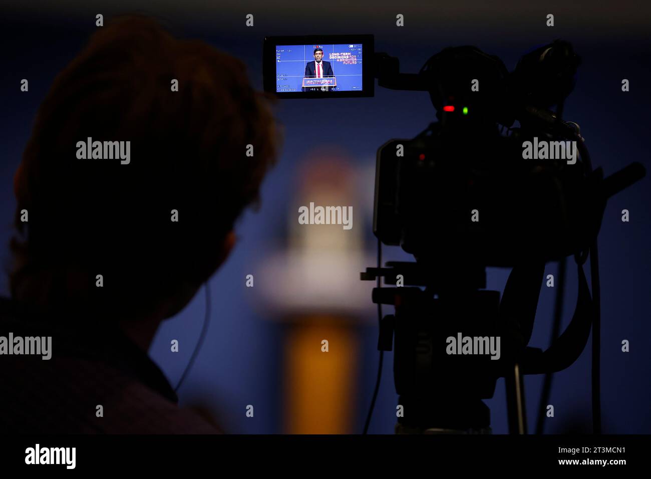 Prime Minister Rishi Sunak is seen on the screen of a camera as he ...