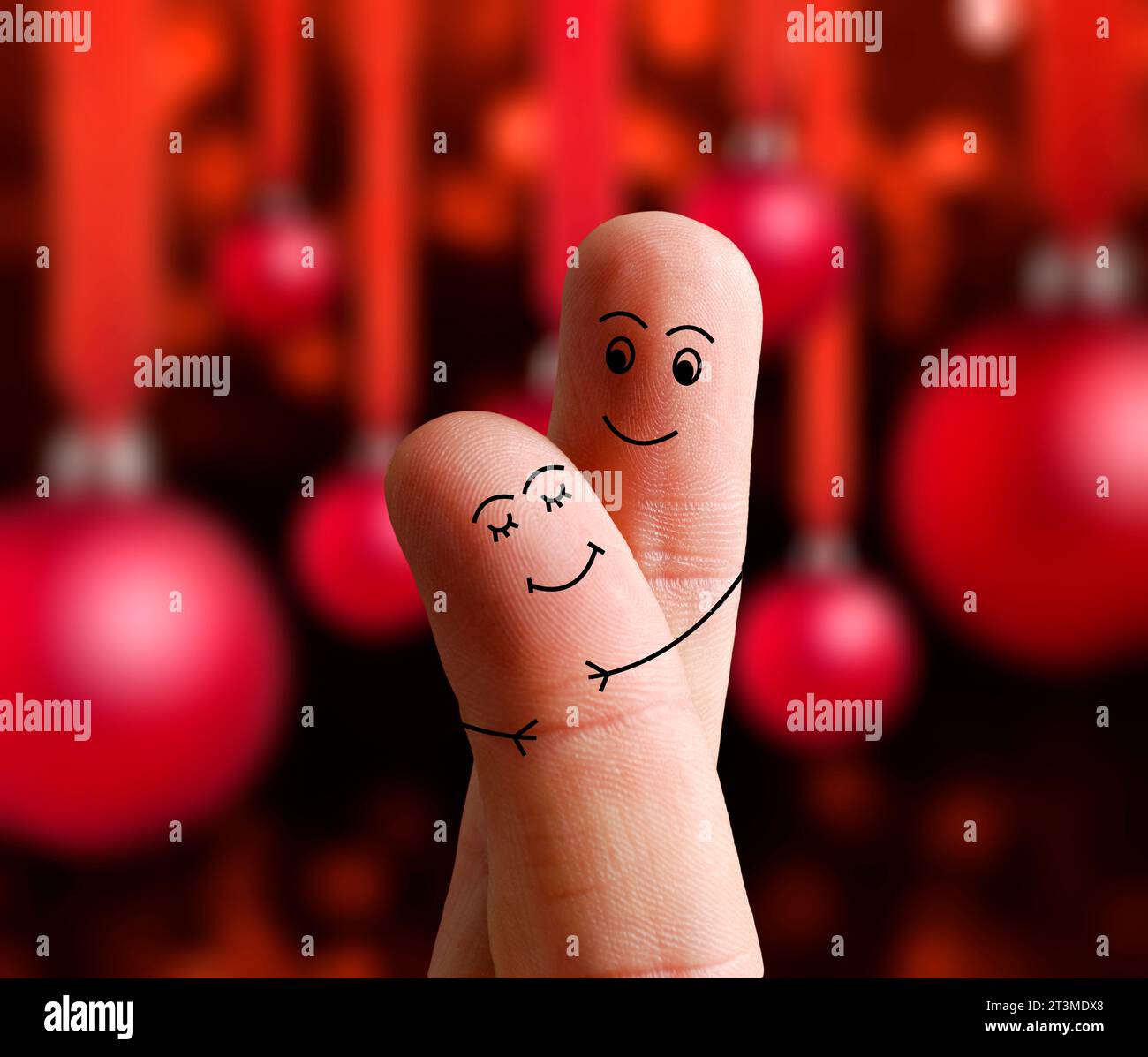 Faces of fingers hugging each other isolated on Christmas decorated ...