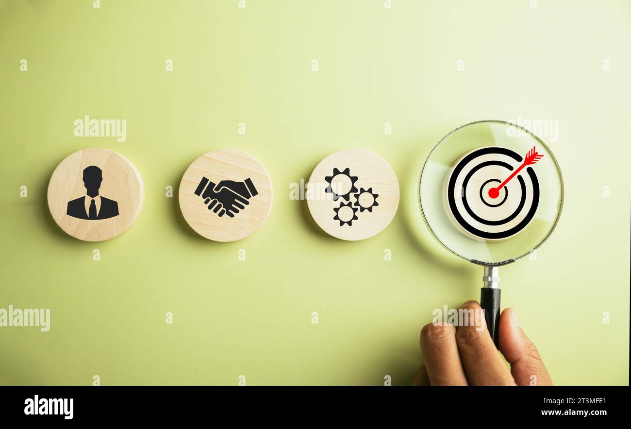 Target icon under magnifying glass Stock Photo - Alamy