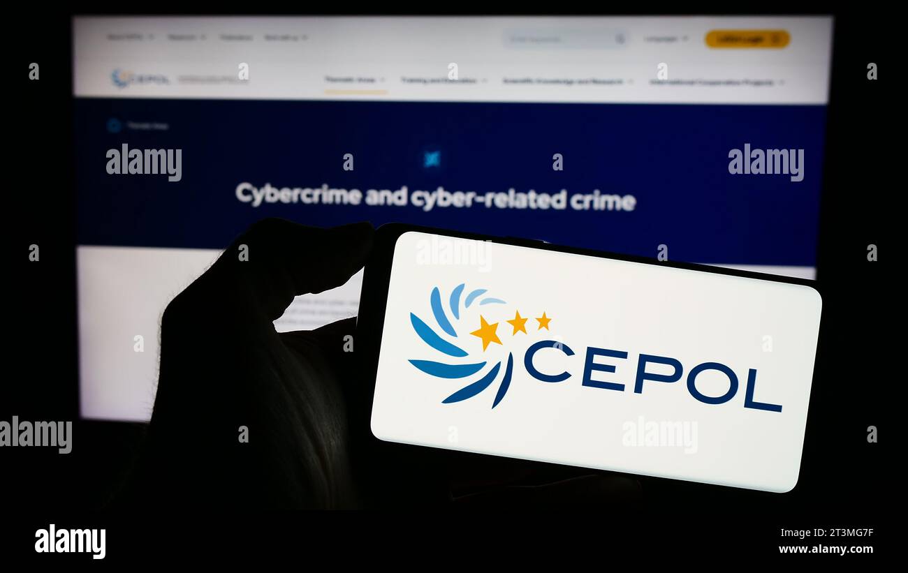 Person holding cellphone with logo of European Union Agency for Law ...