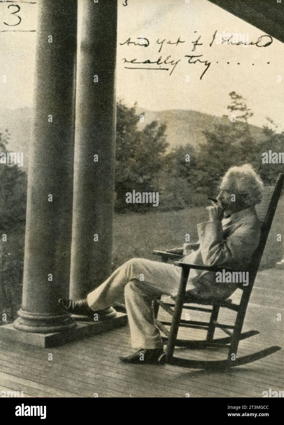American writer Mark Twain sitting in a chair in the porch, USA 1900s ...